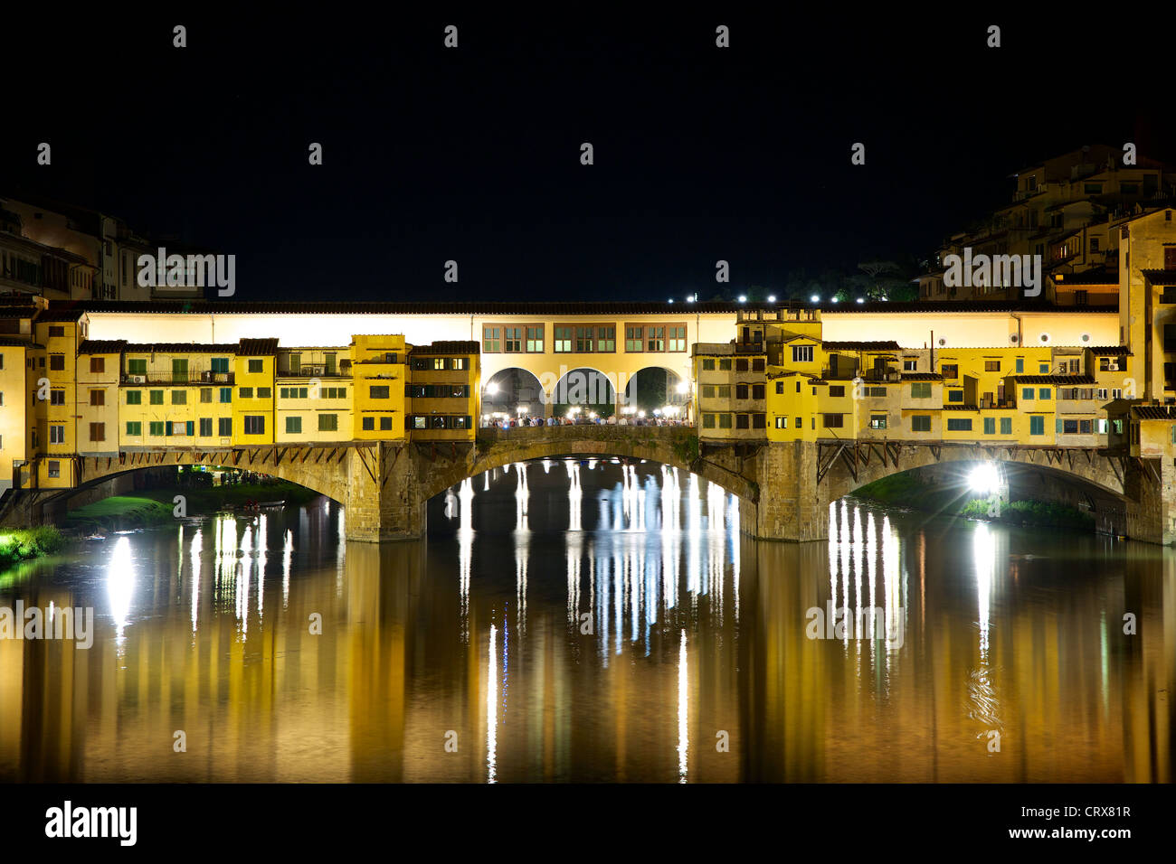 A Night time shot of the Ponte Vecchio (Old Bridge) at the Arno River ...