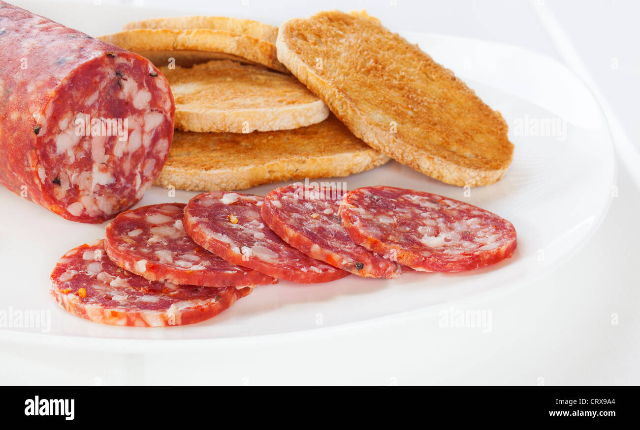 Sliced salami and toast Stock Photo - Alamy