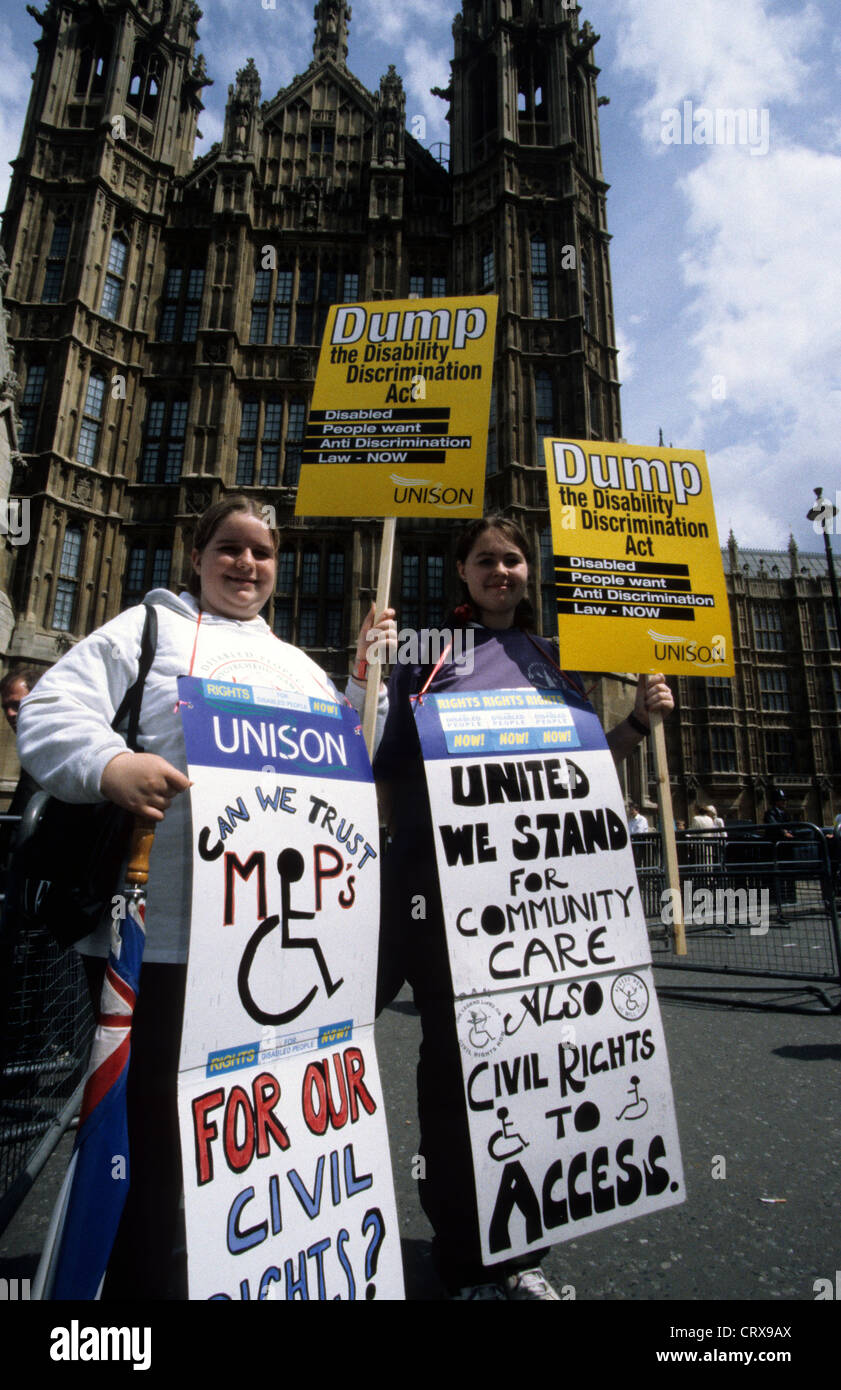 Disability protesters with banners at Westminster England uk Stock ...
