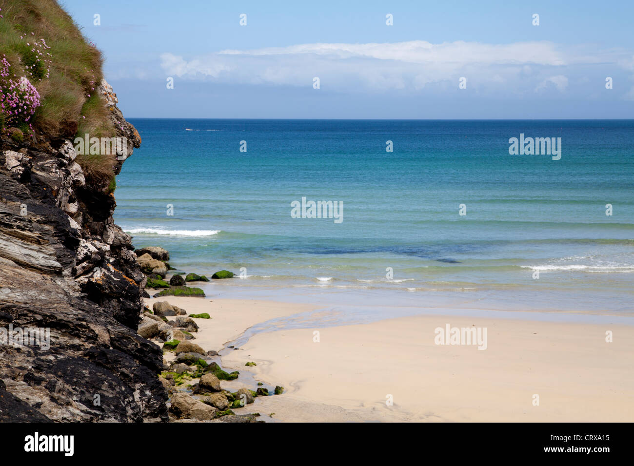View of the Sea and beach with cliff to the left Stock Photo - Alamy