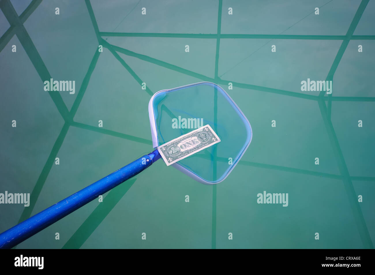 Concept image of money being scooped out of swimming pool Stock Photo ...