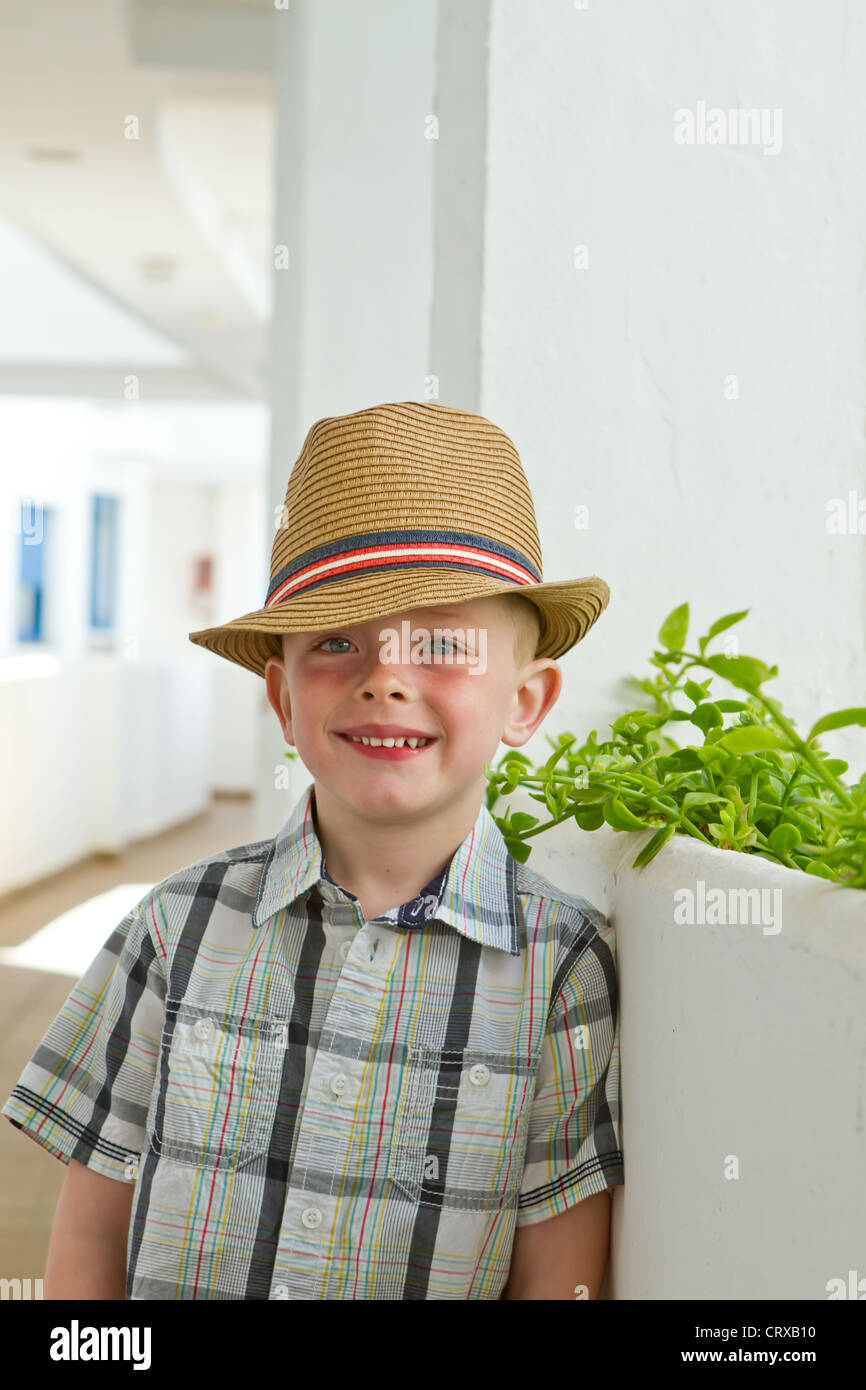 Good looking young boy posing whilst in a hot country Stock Photo - Alamy