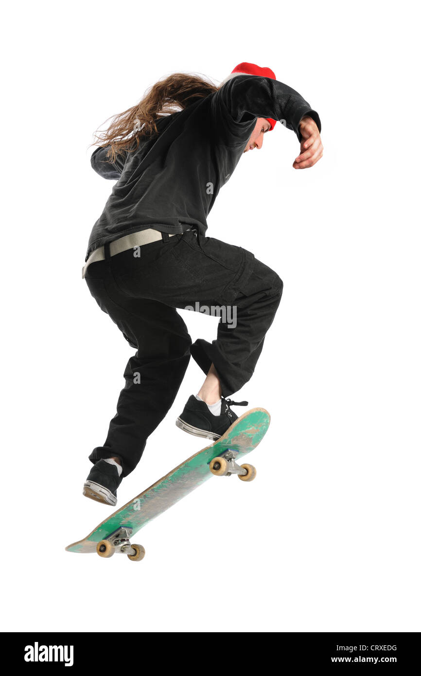 Skateboarder jumping isolated over white background Stock Photo - Alamy