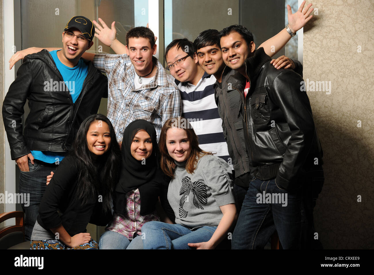 Group of diverse students smiling indoors Stock Photo - Alamy
