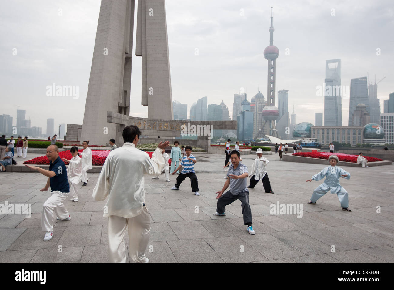 Early morning tai chi on The Bund in Shanghai, with Pudong skyline in ...