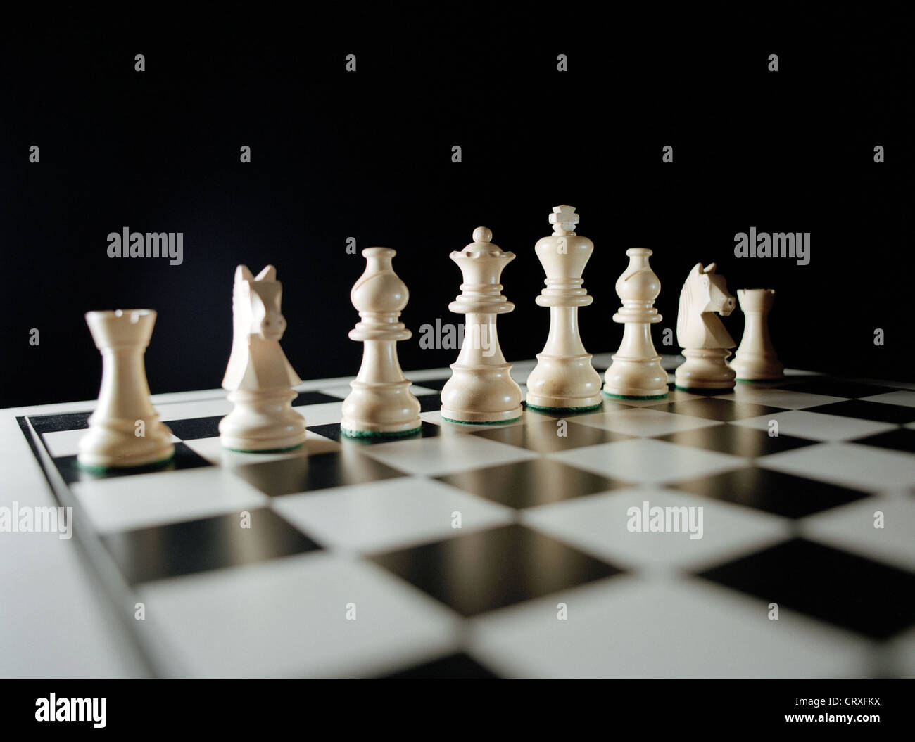 A set of chess pieces on a game board Stock Photo - Alamy
