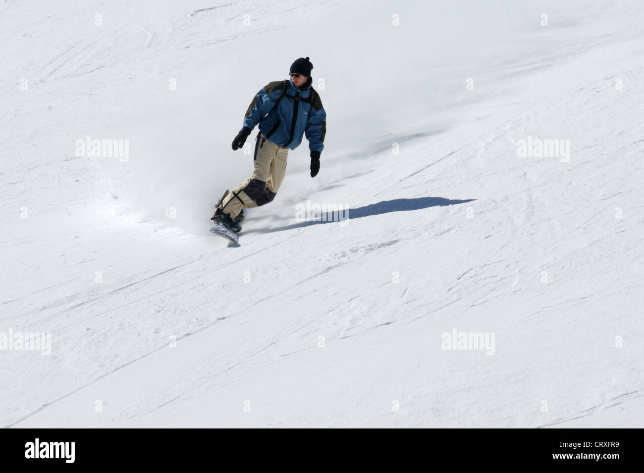 A snowboarder on the slopes of the summit Nair Stock Photo - Alamy