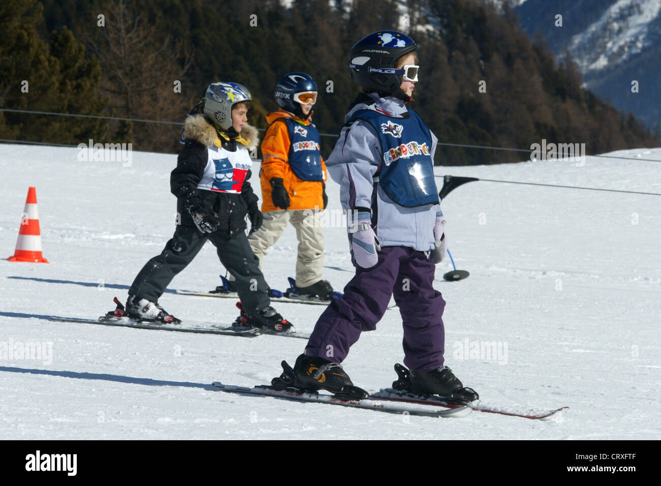 Children while skiing on the slopes Stock Photo - Alamy