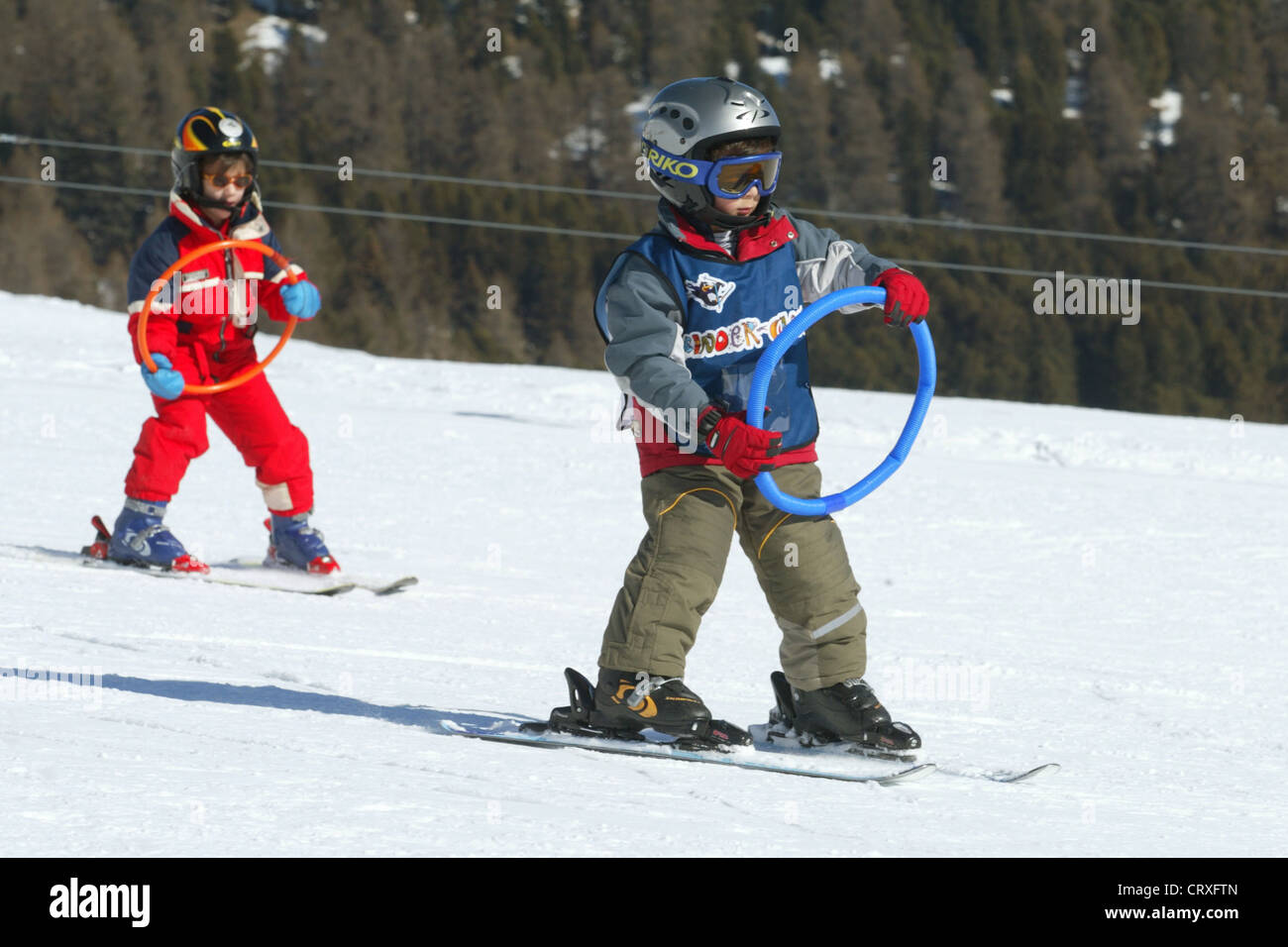 Children while skiing on the slopes Stock Photo - Alamy