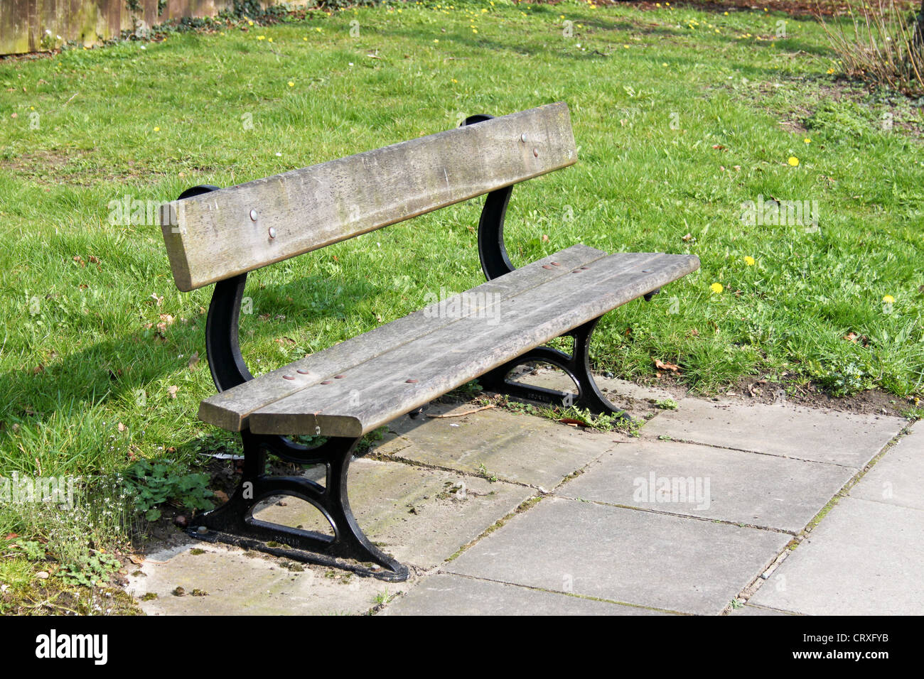 a side on view of a park bench Stock Photo - Alamy