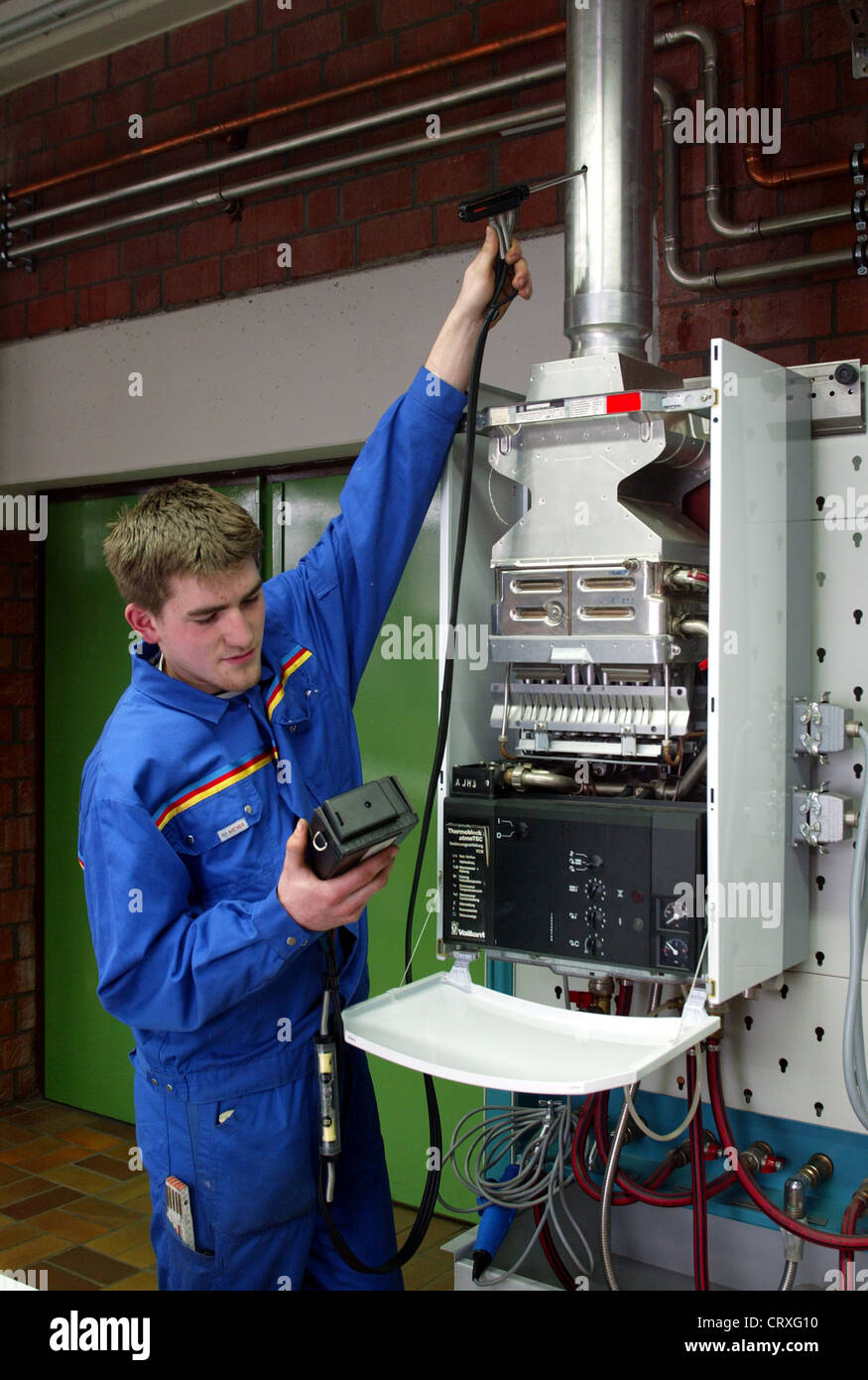 Systems engineers, heating engineer checks a gas heater Stock Photo - Alamy