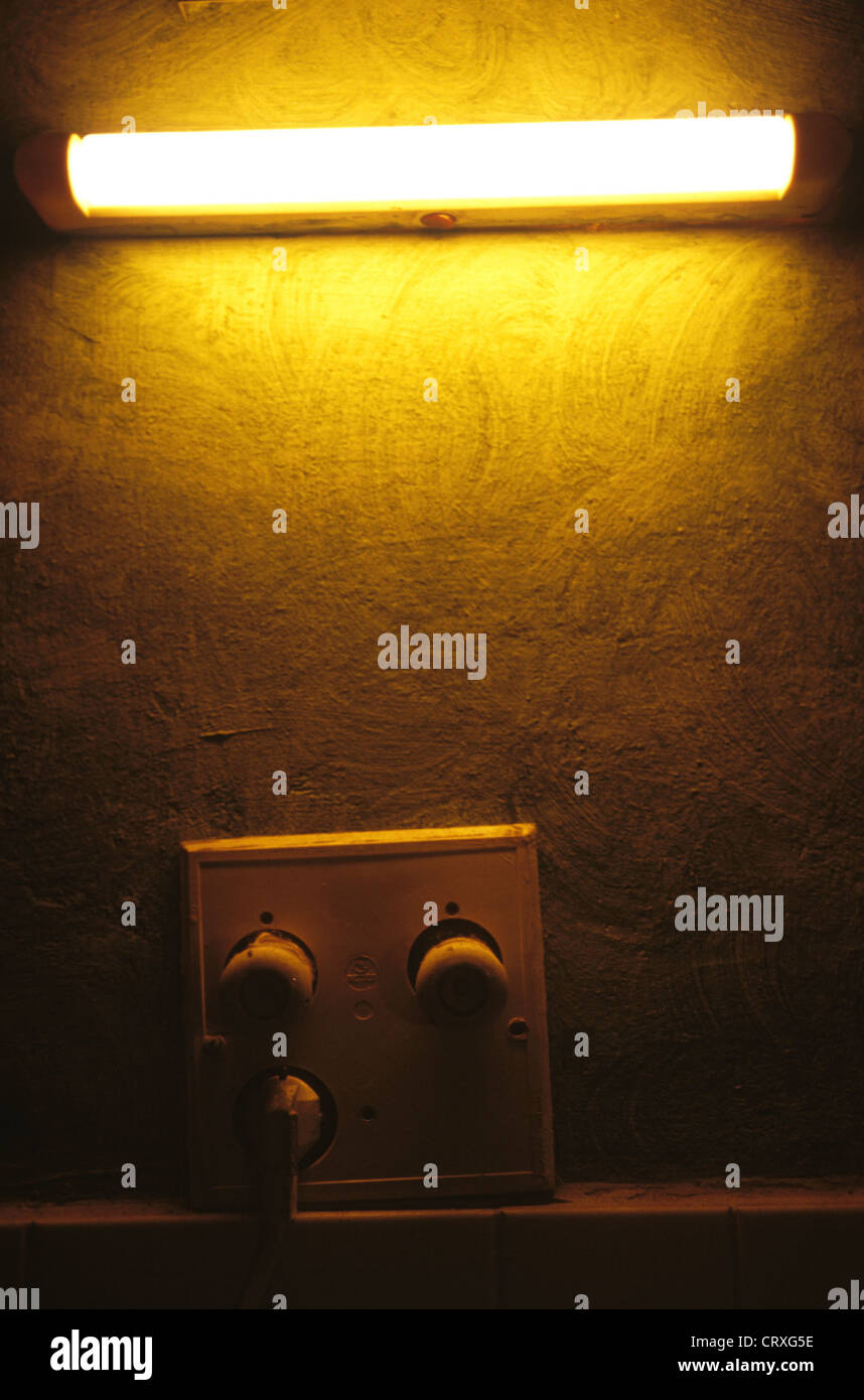 Burning lamp hangs over the old fuse box Stock Photo - Alamy