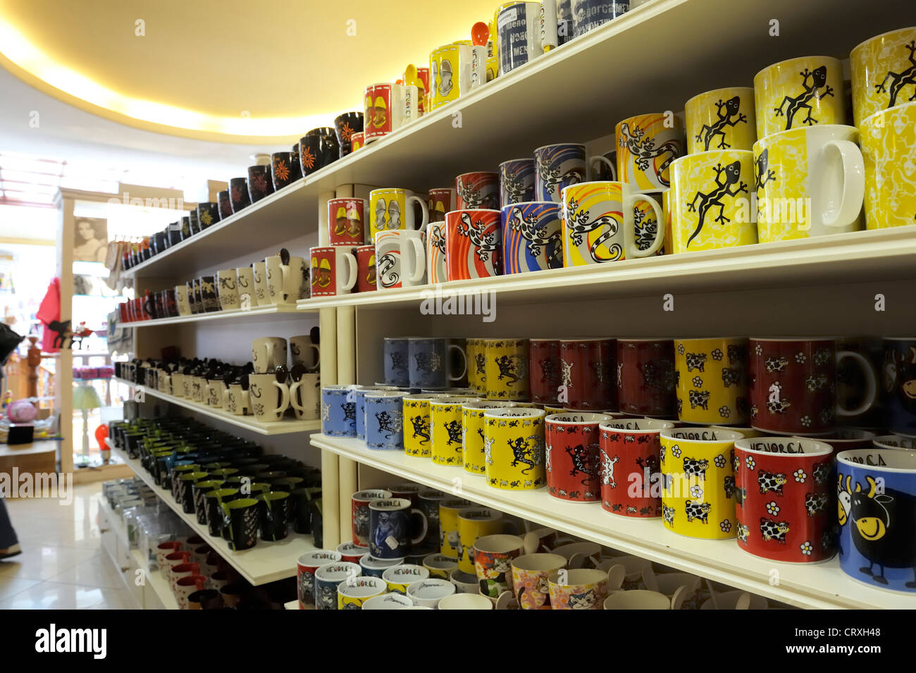 holiday souvenir shop with a choice of mugs on the shelves mahon ...