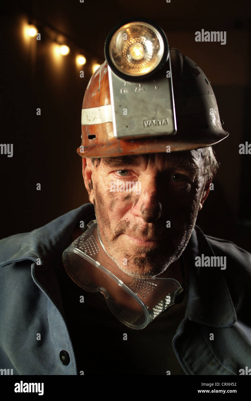 Mine worker with helmet and full body coal dust Stock Photo - Alamy