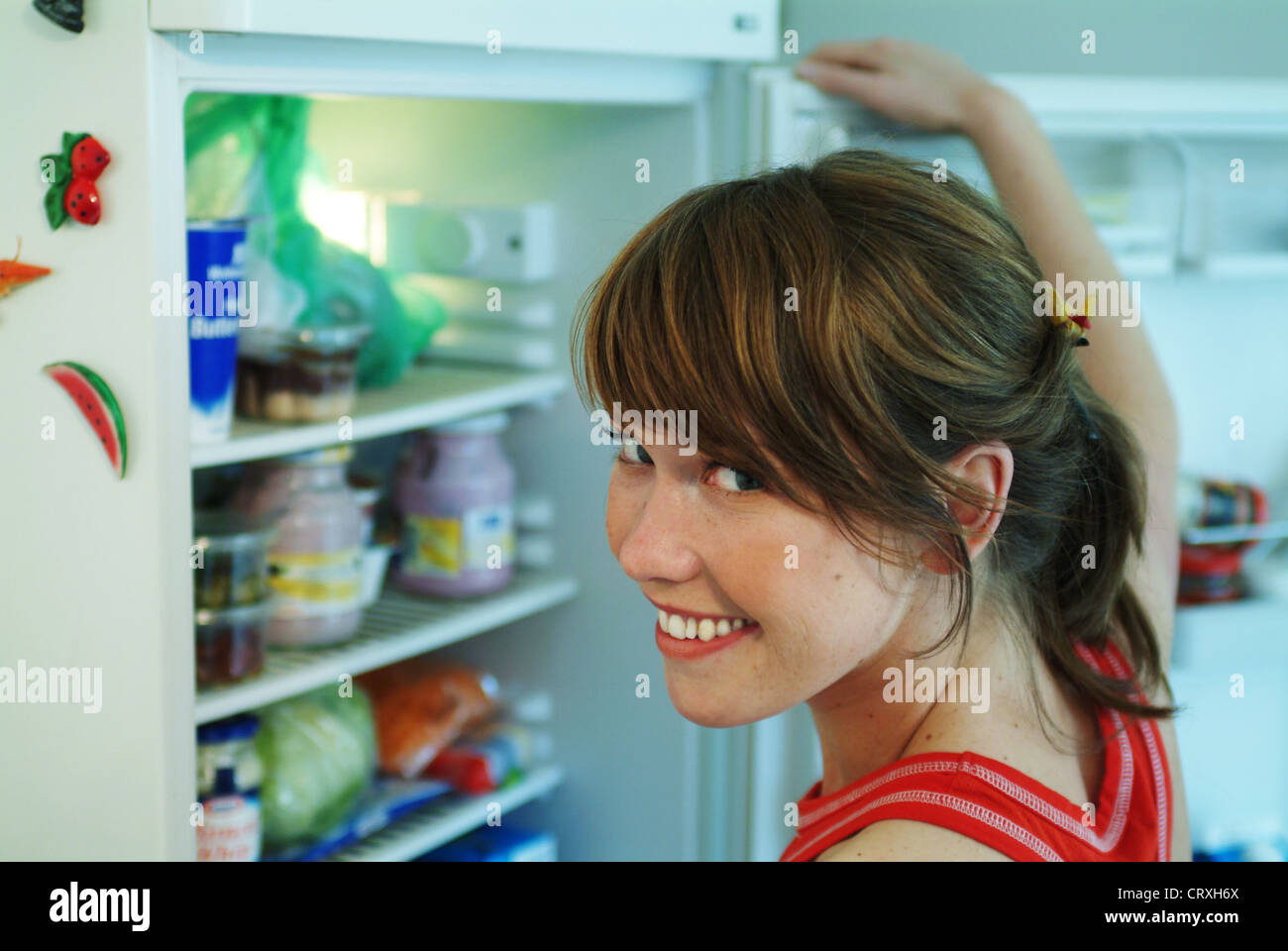 Woman refrigerator cravings hi-res stock photography and images - Alamy