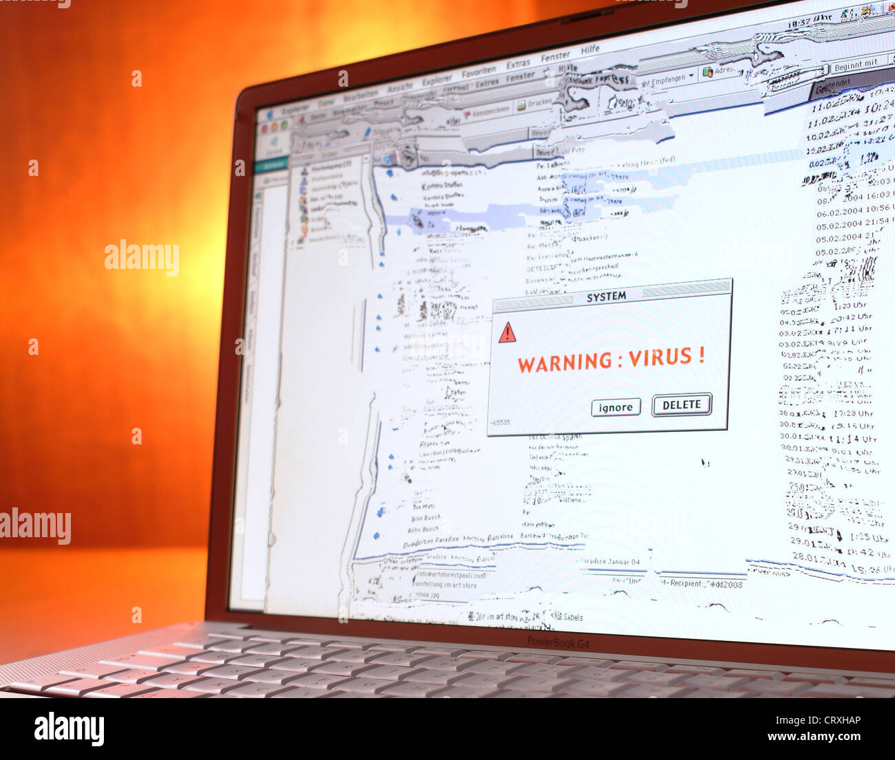 Notebook computer is infected by virus Stock Photo - Alamy