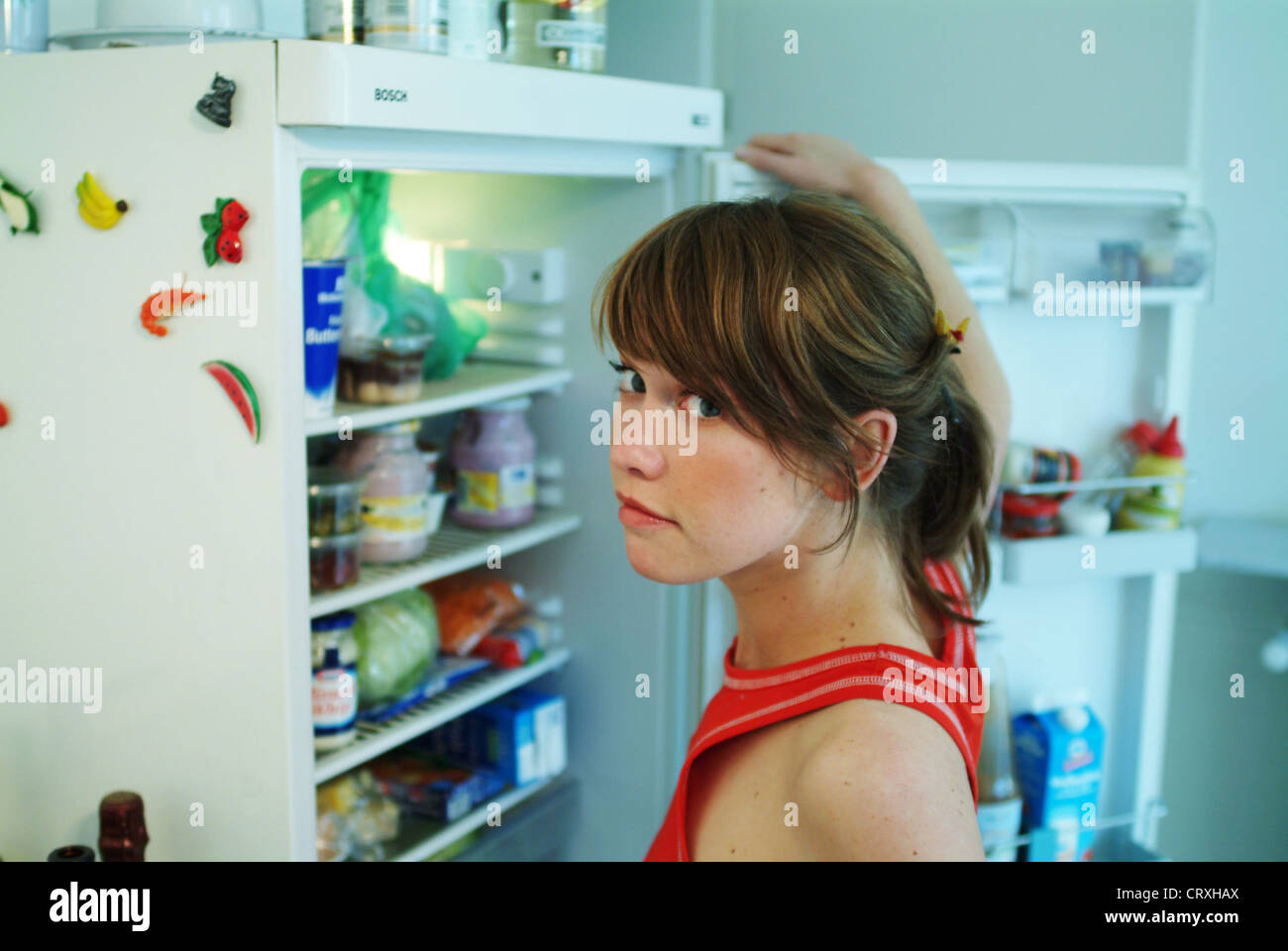 Young woman on the fridge Stock Photo - Alamy