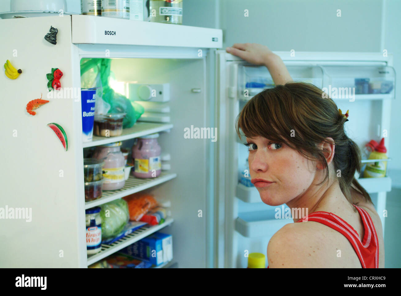 Young woman on the fridge Stock Photo - Alamy