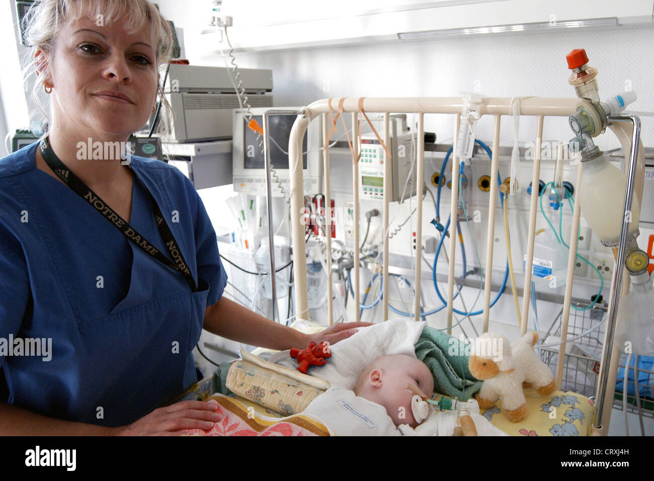 Sister with ventilated child to child-ICU Stock Photo - Alamy