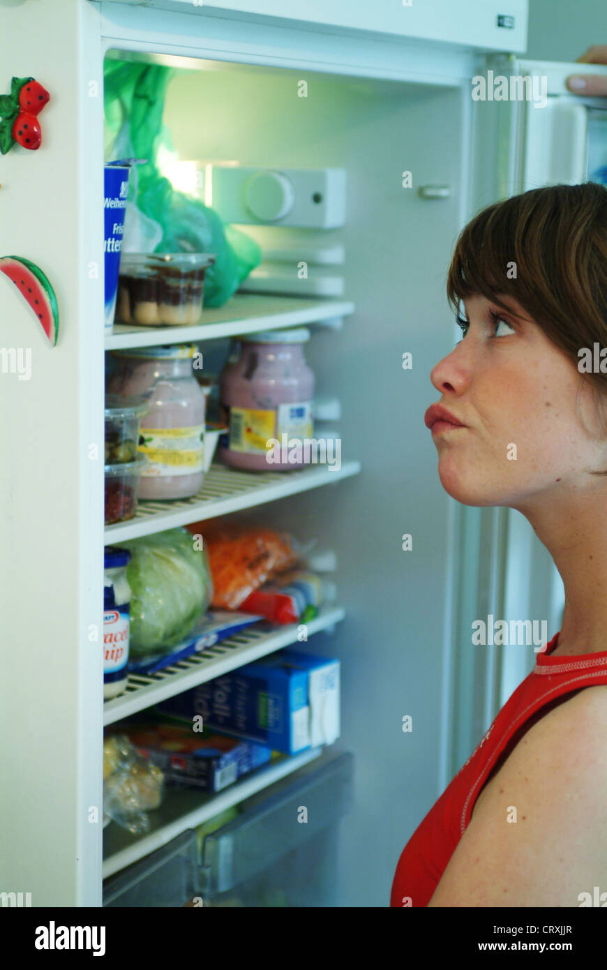 Young woman on the fridge Stock Photo - Alamy