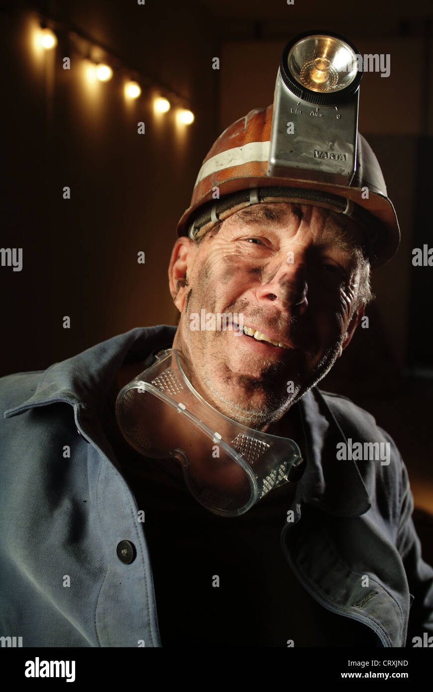 Mine worker with helmet and full body coal dust Stock Photo - Alamy