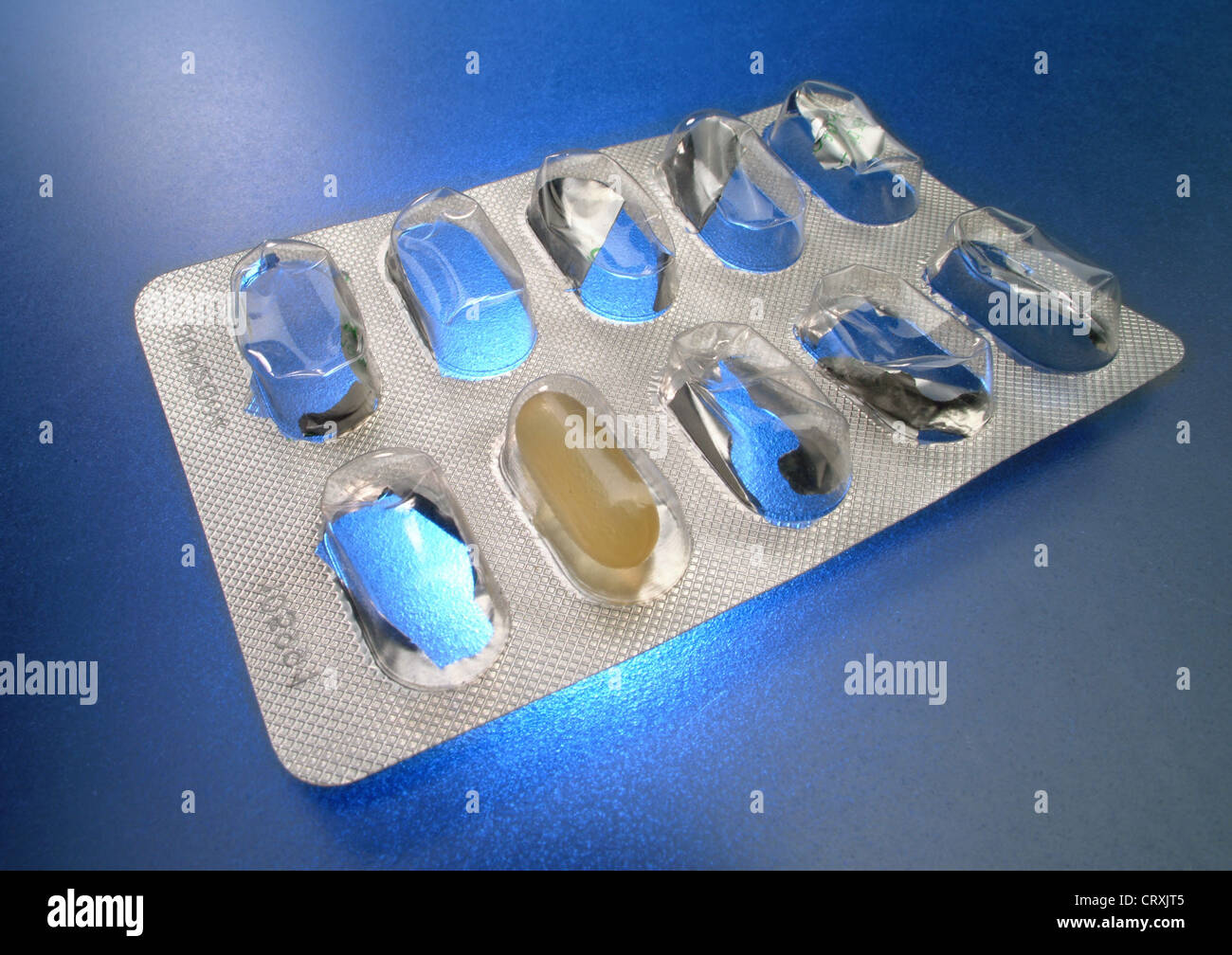 Opened pack of tablets with just one tablet Stock Photo - Alamy