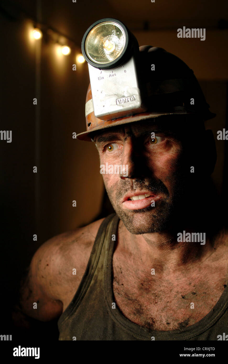 Mine worker with helmet and full body coal dust Stock Photo - Alamy