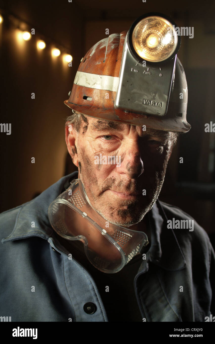 Mine worker with helmet and full body coal dust Stock Photo - Alamy