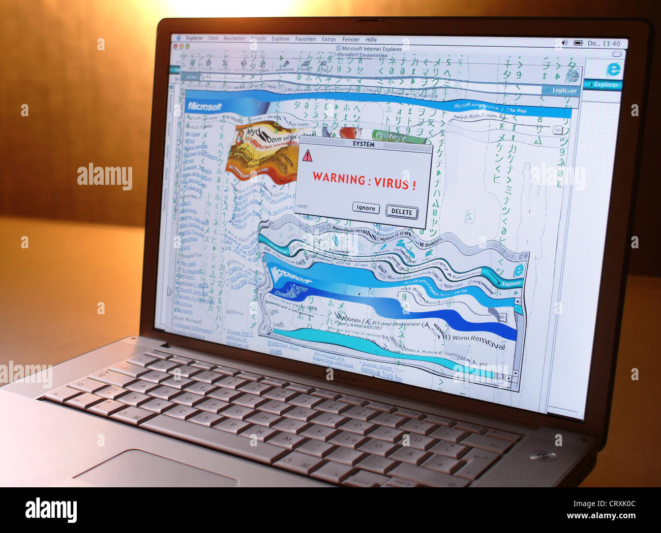 Notebook computer is infected by virus Stock Photo - Alamy