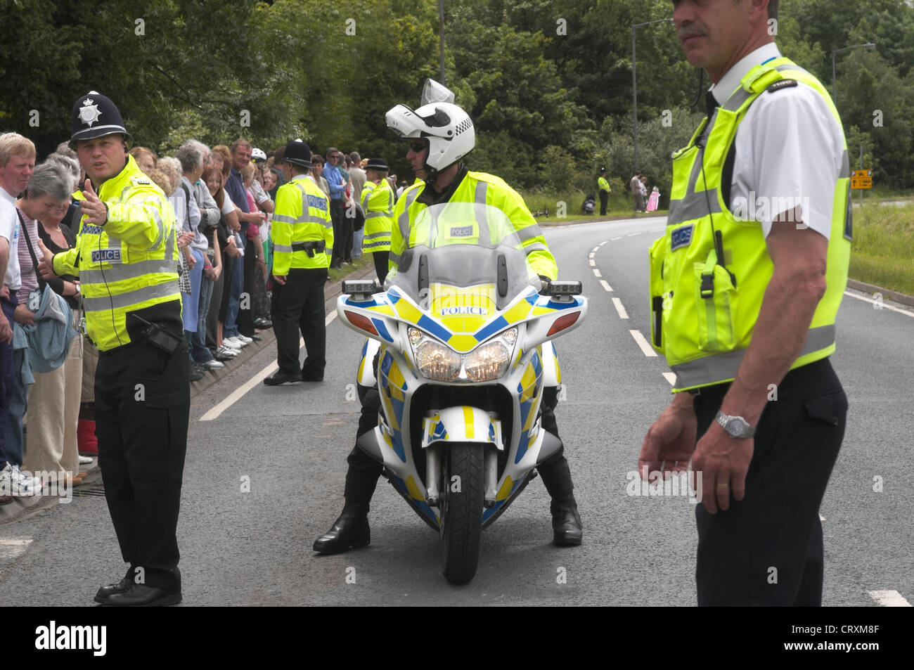 Police marshalling public along roadside during royal visit Stock Photo ...