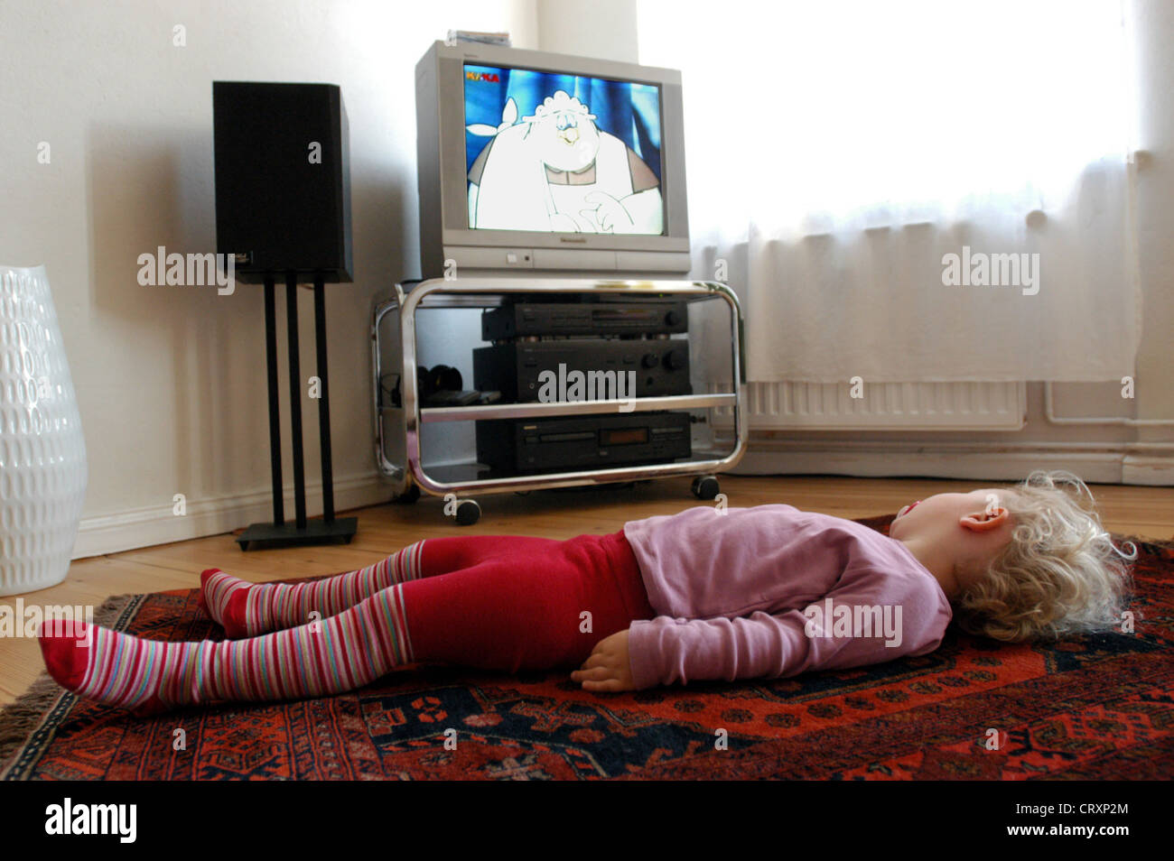 Toddler watching TV Stock Photo - Alamy