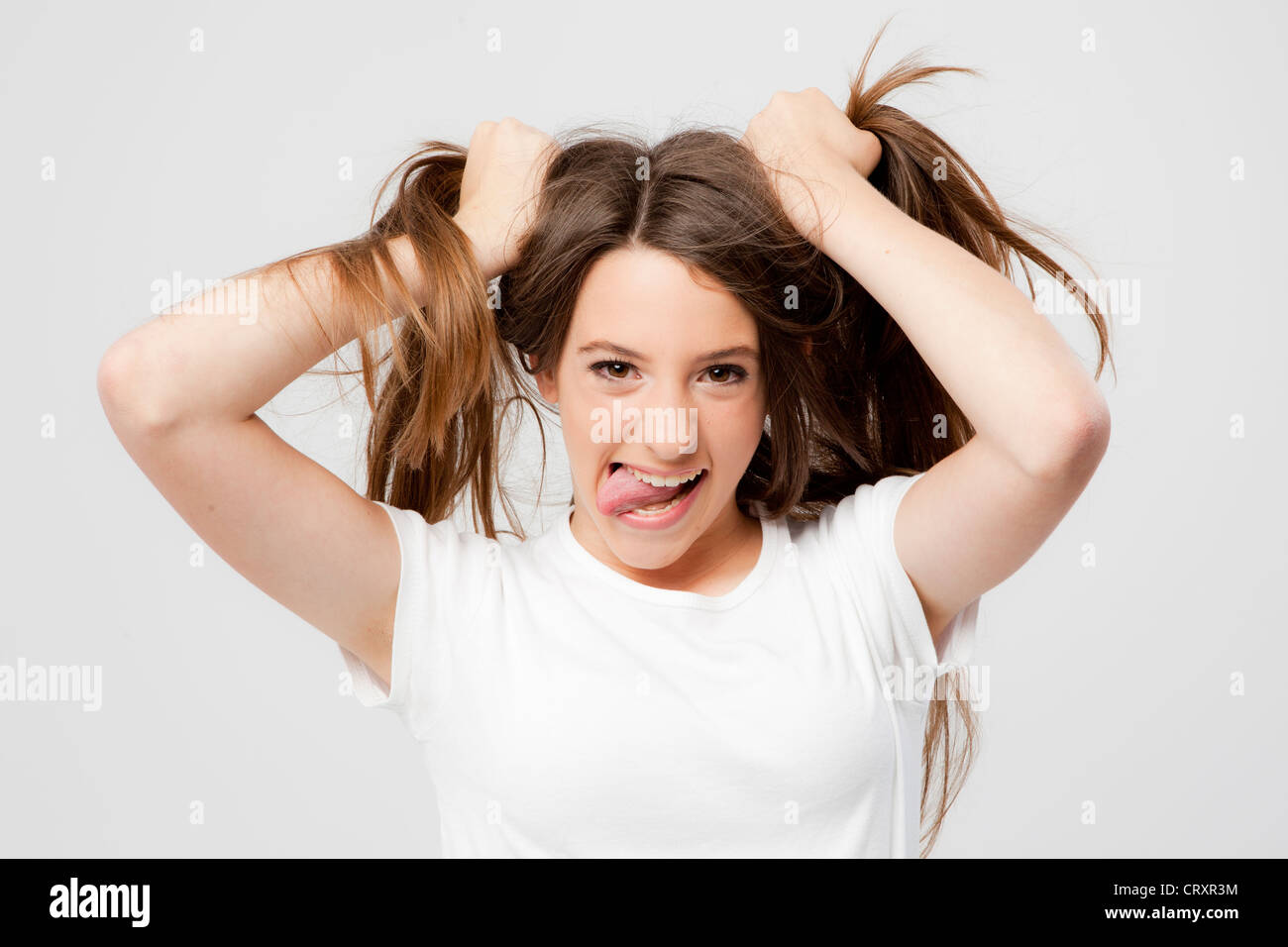 funny expression and gesture of a real young girl Stock Photo - Alamy