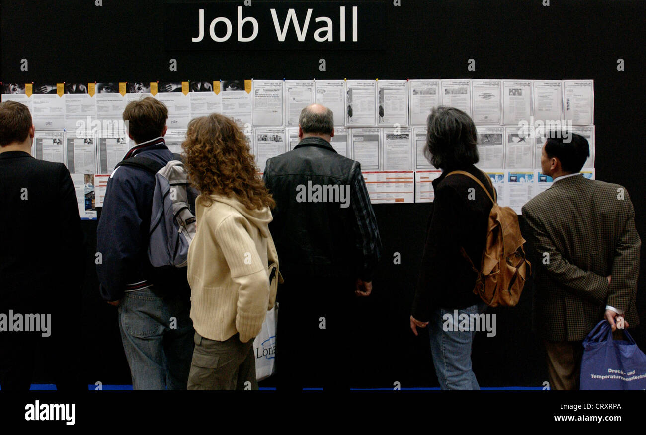 People facing a job wall in Hanover Stock Photo - Alamy