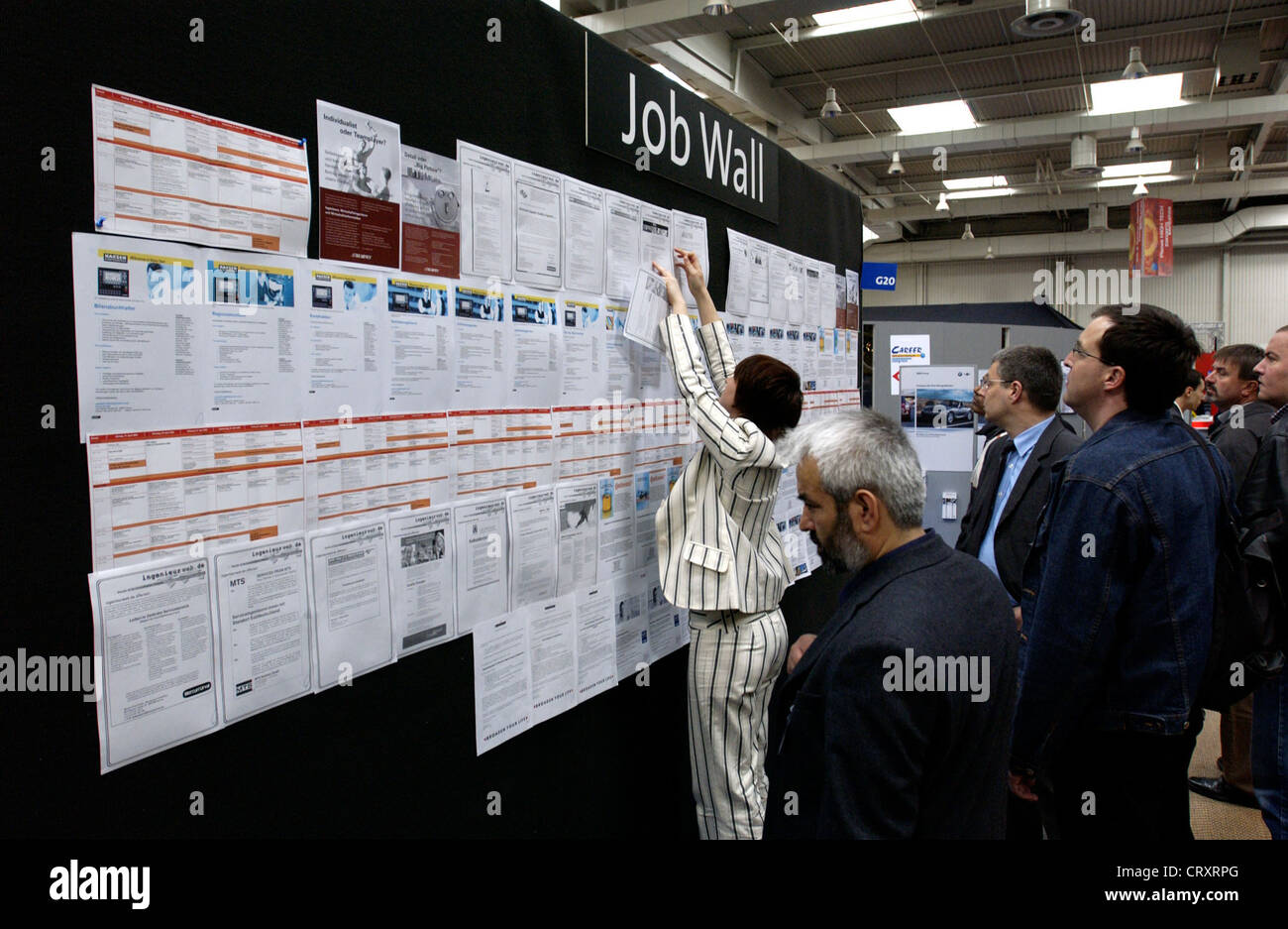People facing a job wall in Hanover Stock Photo - Alamy