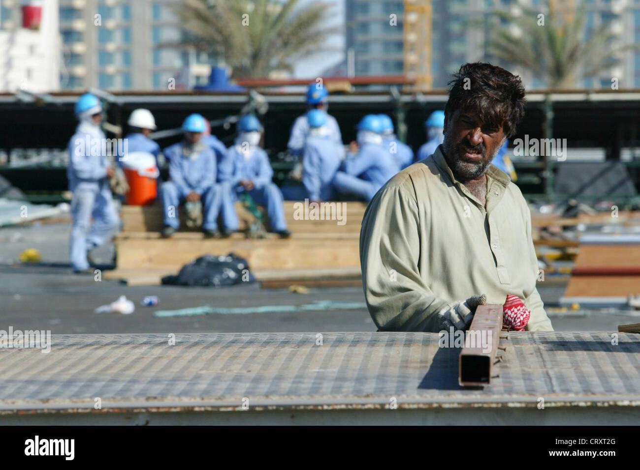 Workers at a construction site in Dubai Stock Photo - Alamy
