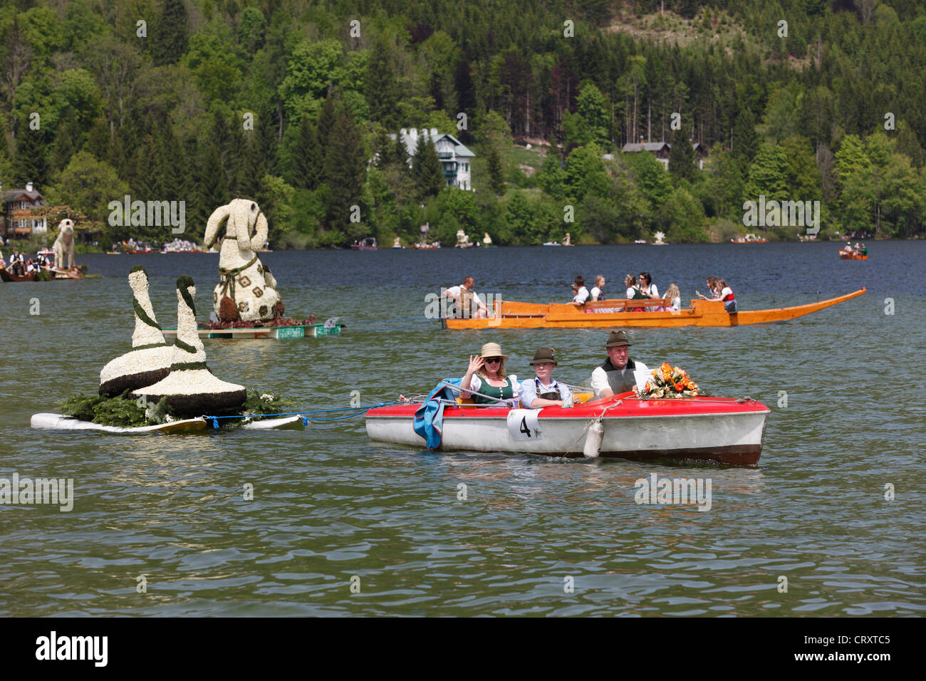 Austria, Styria, People celebrating daffodil festival on Lake Altaussee ...