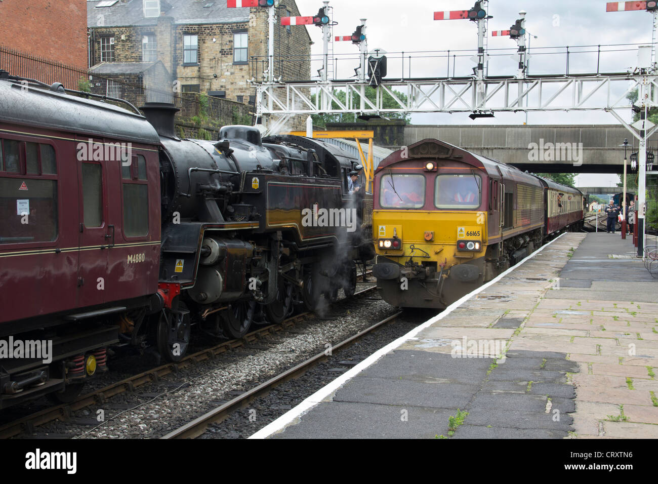 A chartered train excursion from London arrives at Bury station on the ...