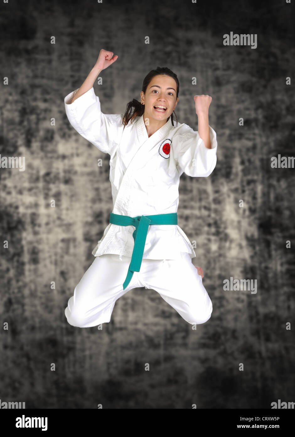 beautiful karate girl in a happyness jumping Stock Photo - Alamy
