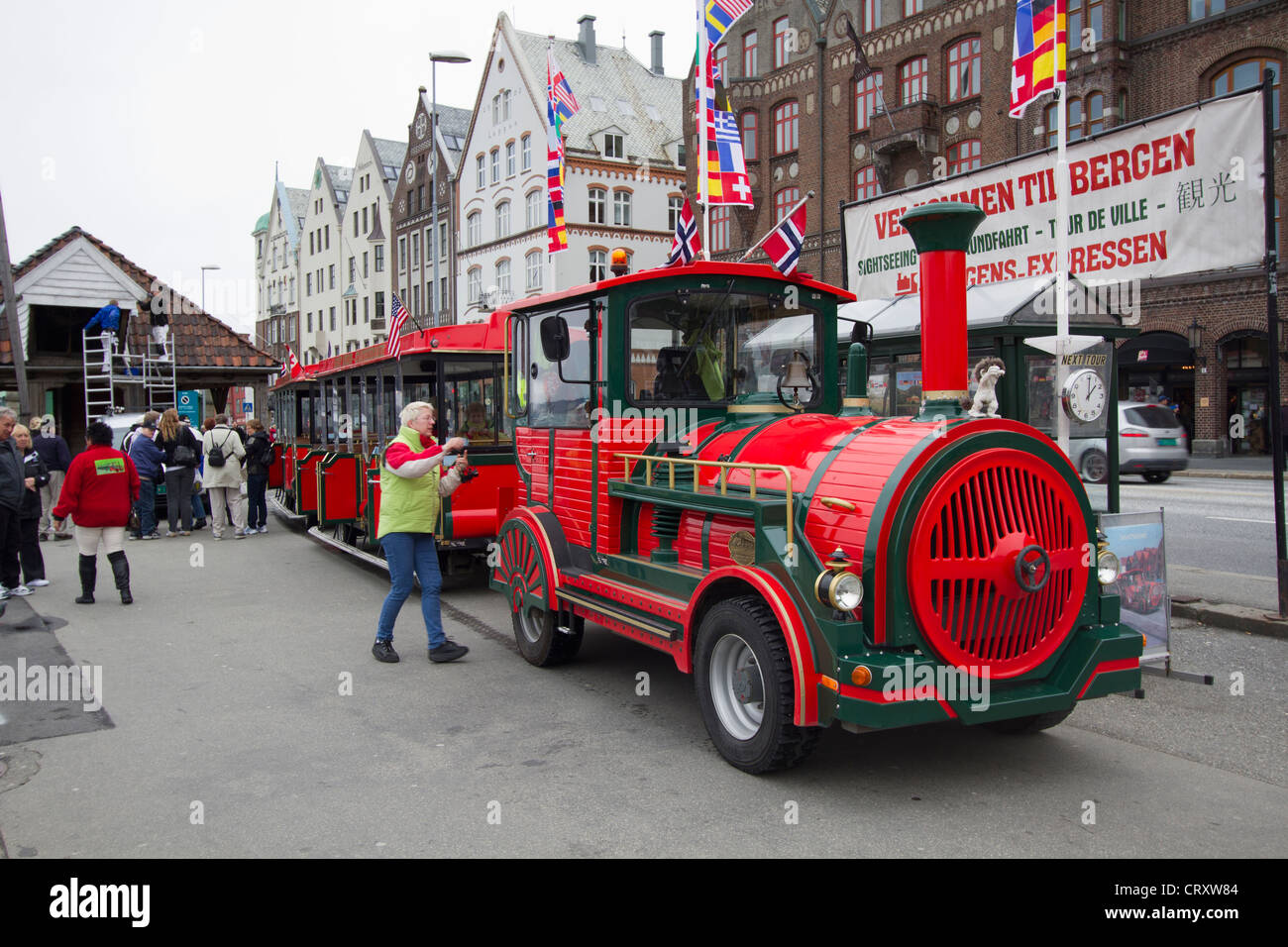A road train in Bergen, Norway. The driver and some passengers wait to ...