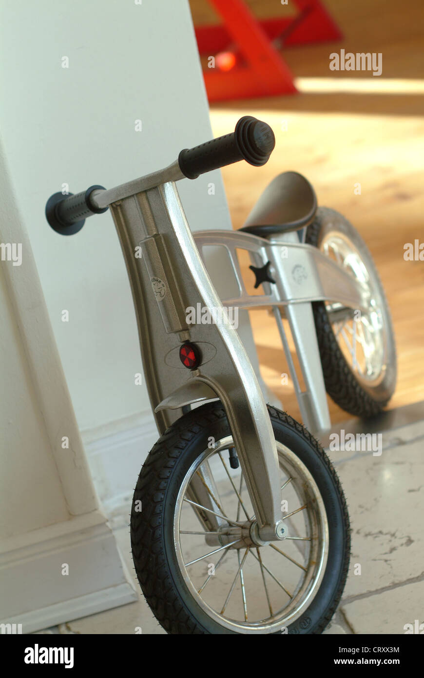 Kids bike in the living room Stock Photo - Alamy