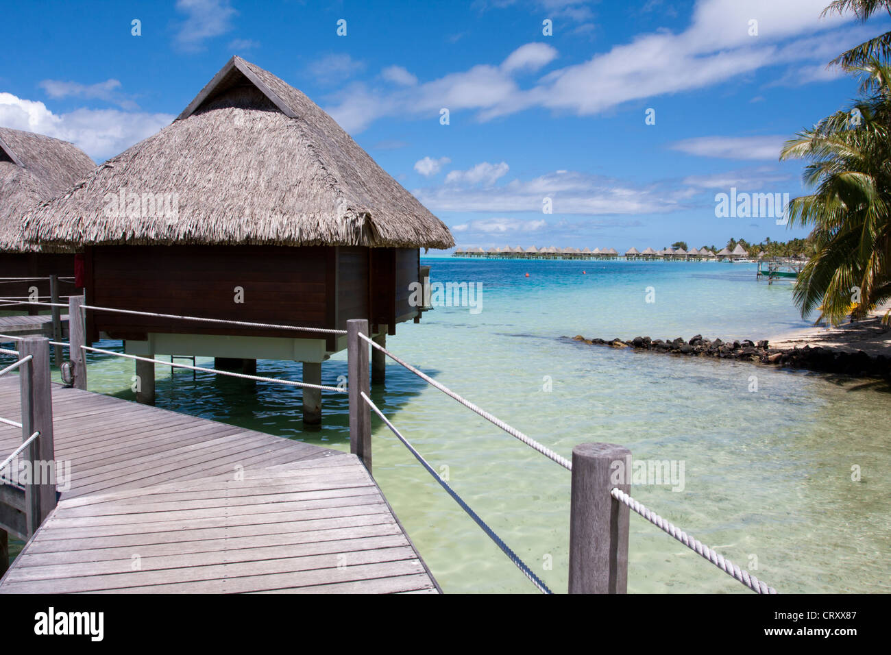 Overwater bungalows on stilts at a resort hotel, Bora Bora, French ...