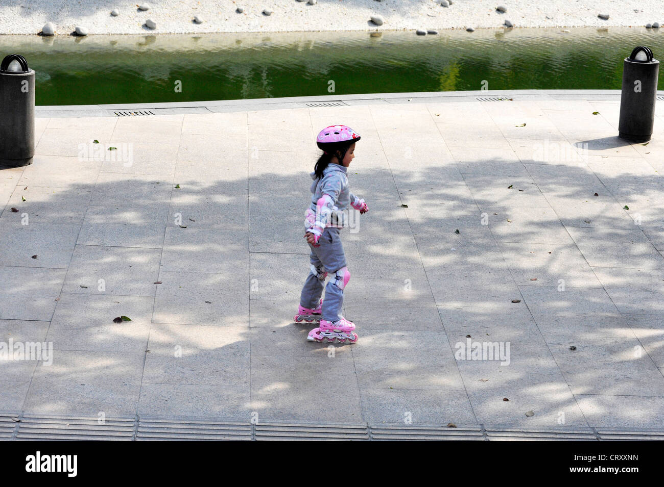 Child rollerblading in Shanghai Stock Photo - Alamy