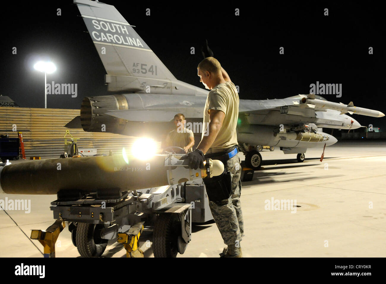 A weapons loader with the 451st expeditionary aircraft maintenance ...
