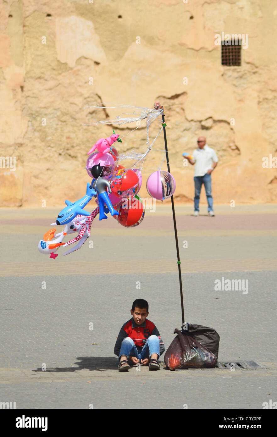 Child selling balloons hi-res stock photography and images - Alamy
