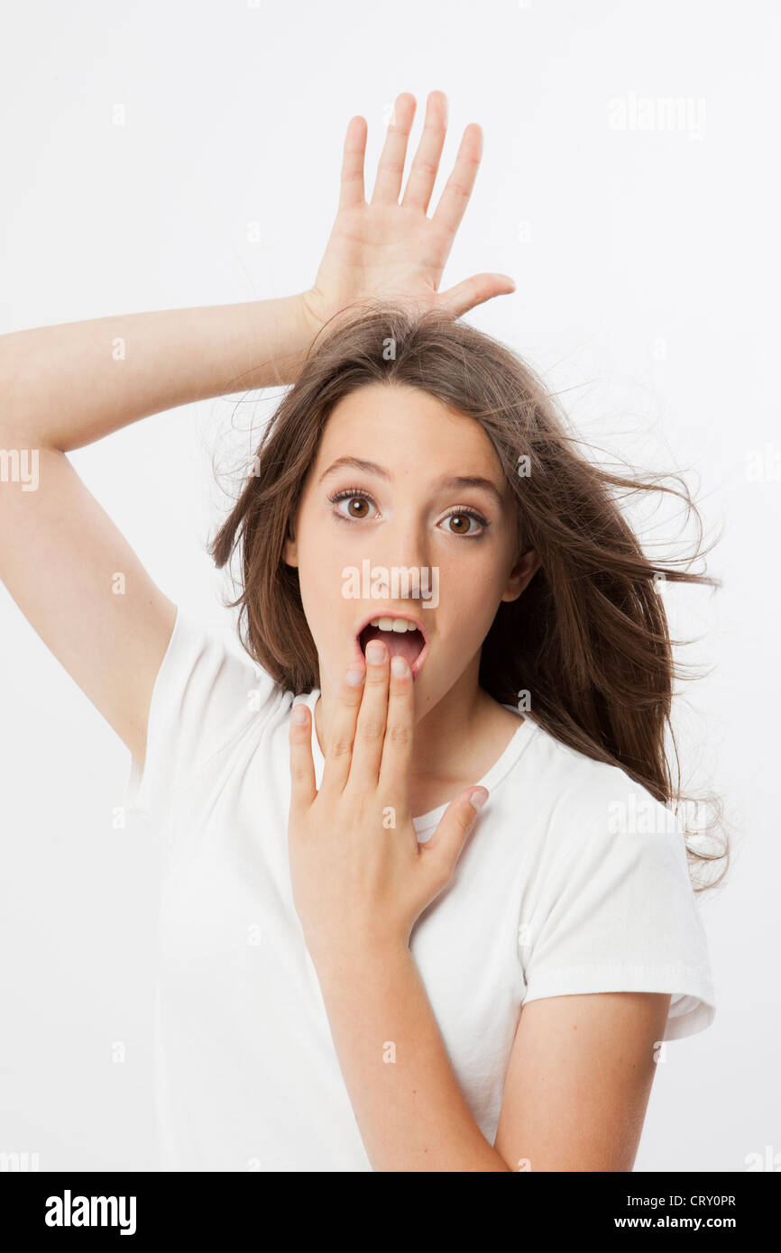 funny expression and gesture of a real young girl Stock Photo - Alamy