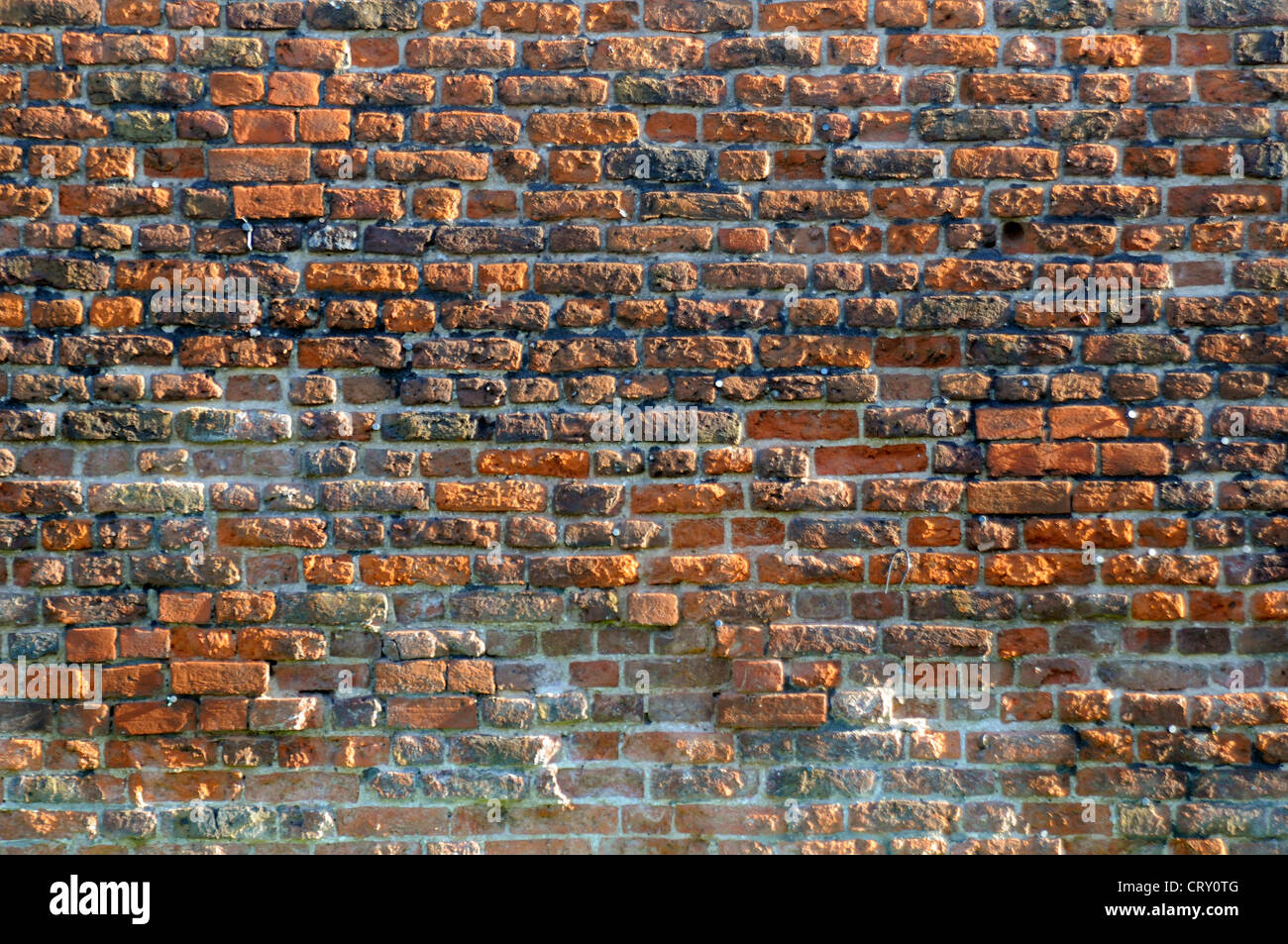 an old red brick wall with damaged bricks and mortar Stock Photo - Alamy