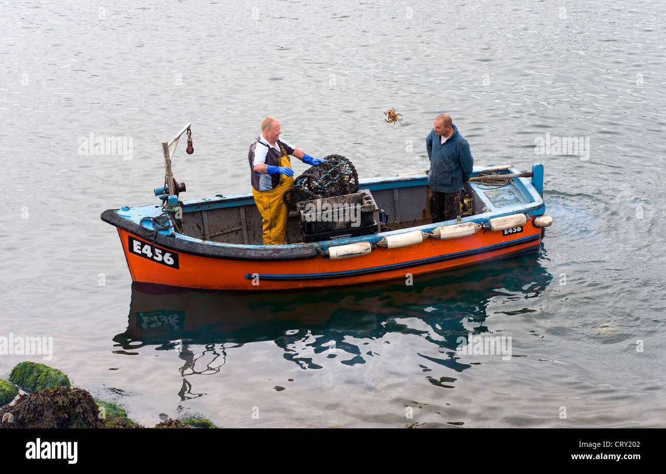fisherman throwing crab into the sea,sloop Devon, devon, dinghy, fish ...