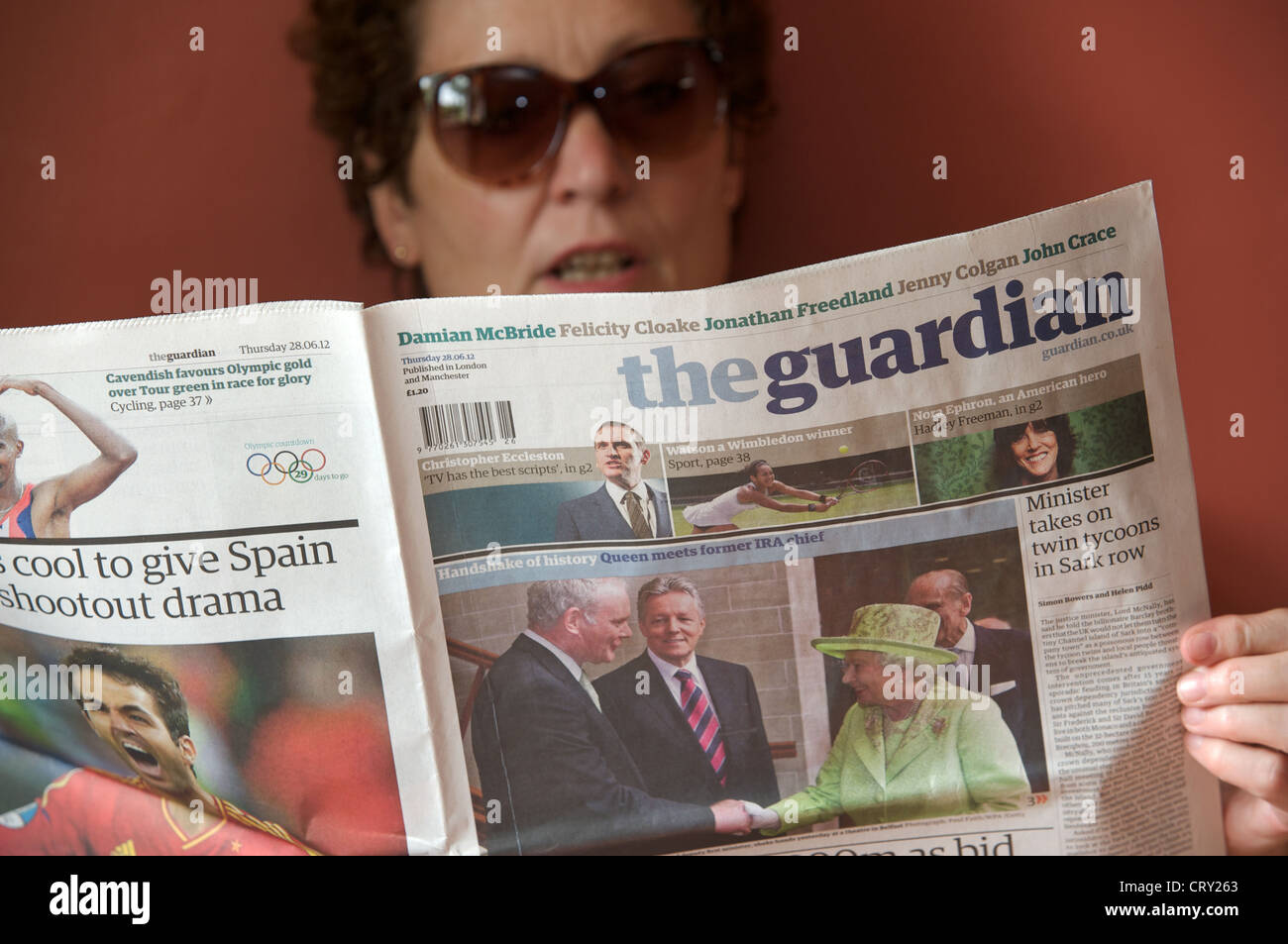 Reading The Guardian Newspaper High Resolution Stock Photography and ...