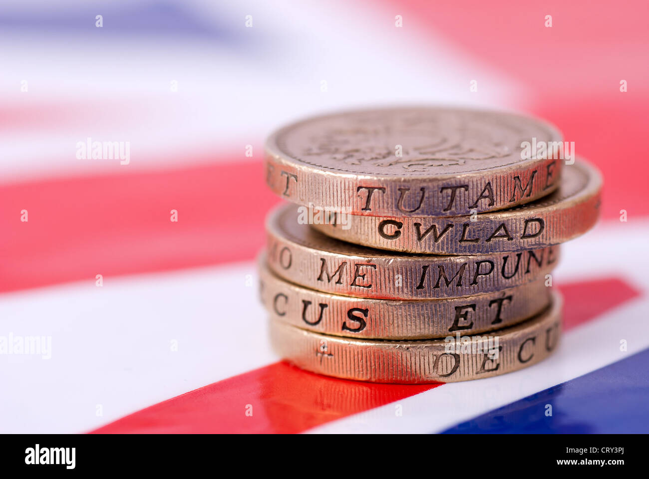 Stack of One Pound Coins over a Union Jack Background Stock Photo - Alamy