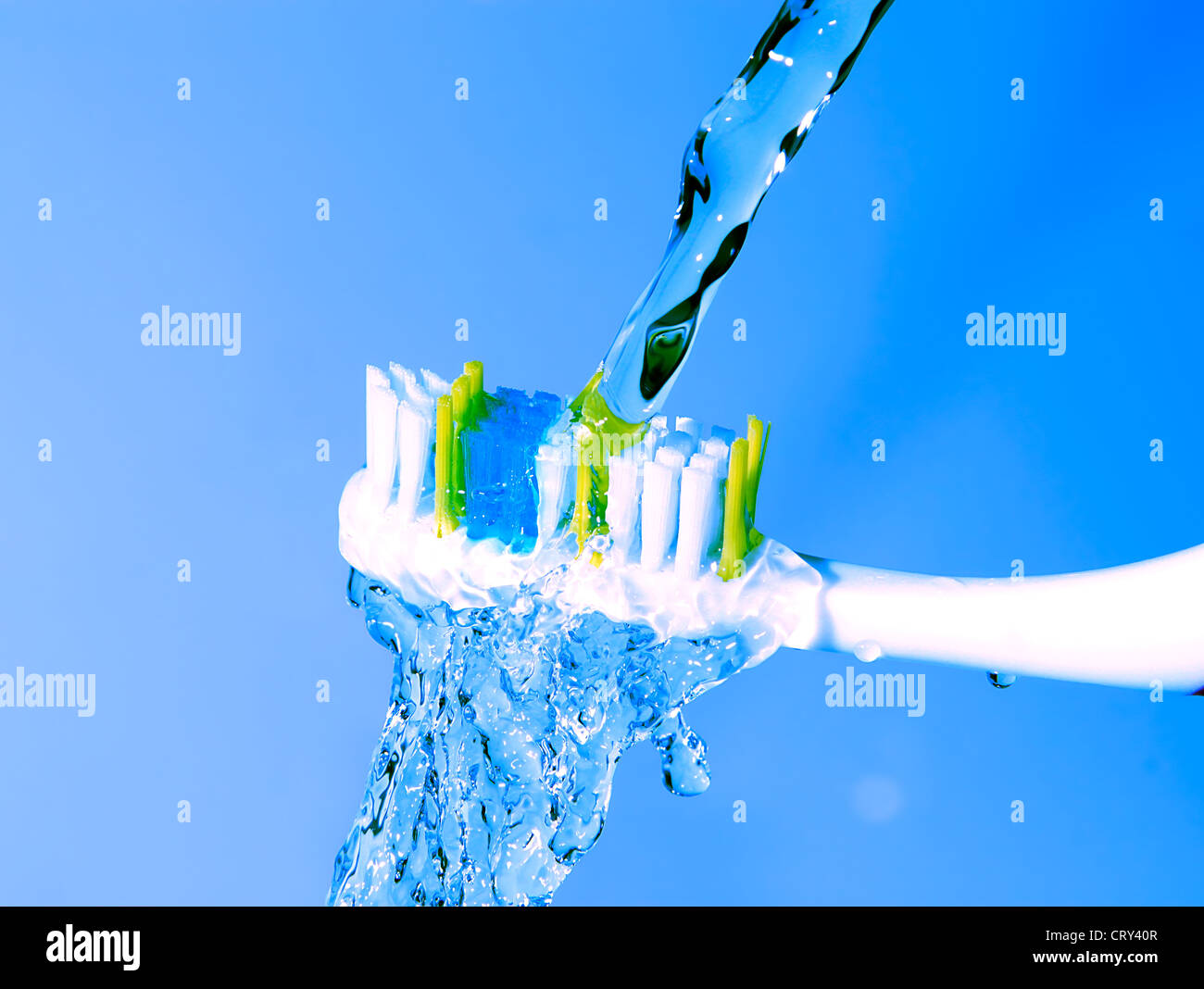 Toothbrush under running water hi-res stock photography and images - Alamy